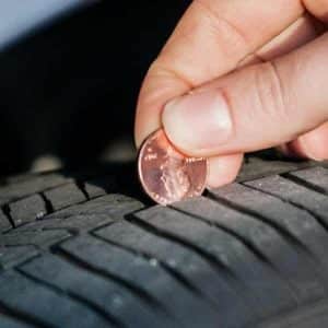 The Penny Test: How to Measure Tread Depth with Penny - DrivingPress